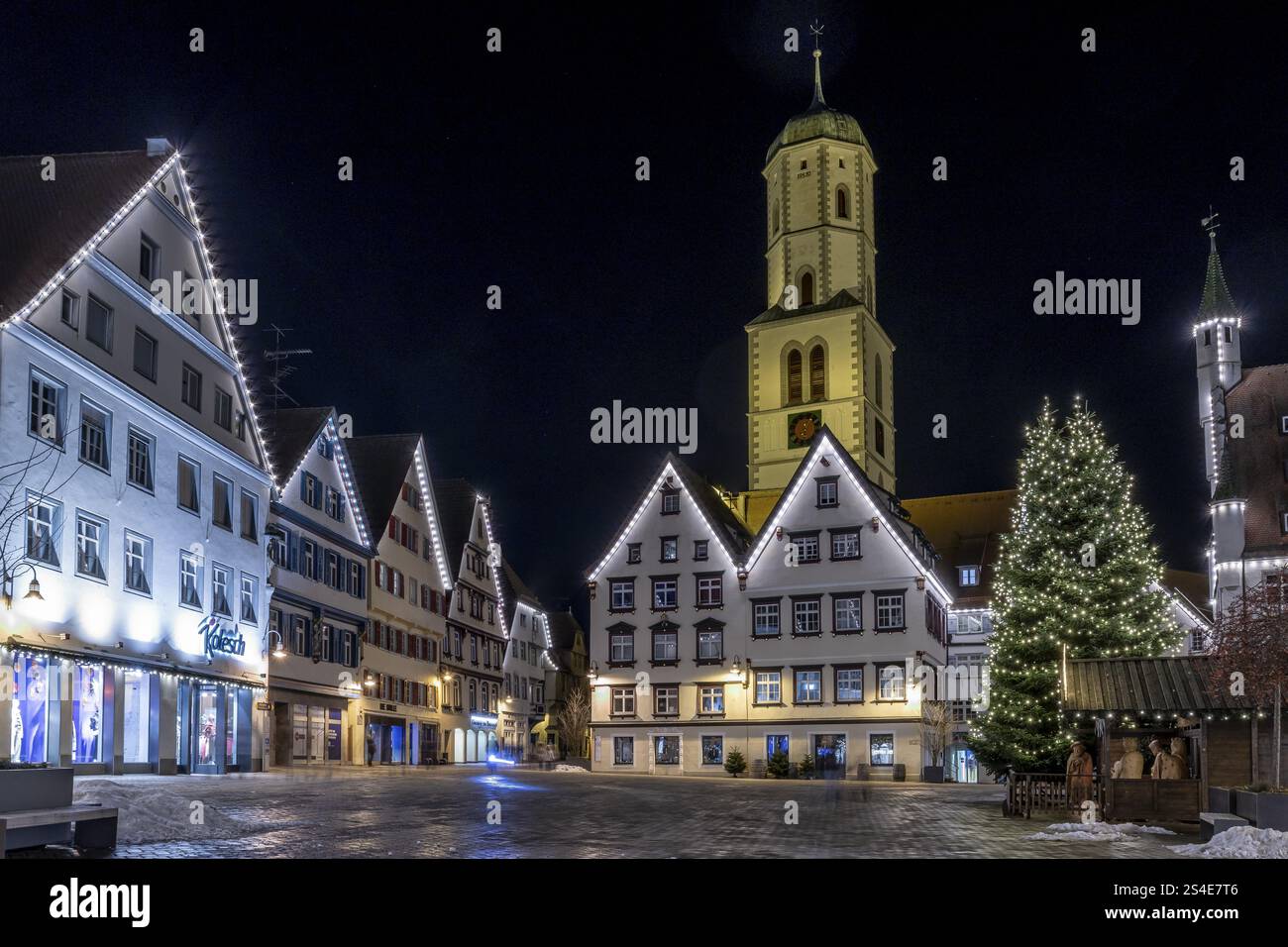 Night photo of historic buildings around the market square with ...