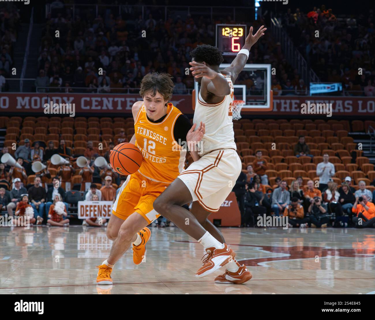 Tennessee forward Case Phillips, left, drives the ball against Texas ...