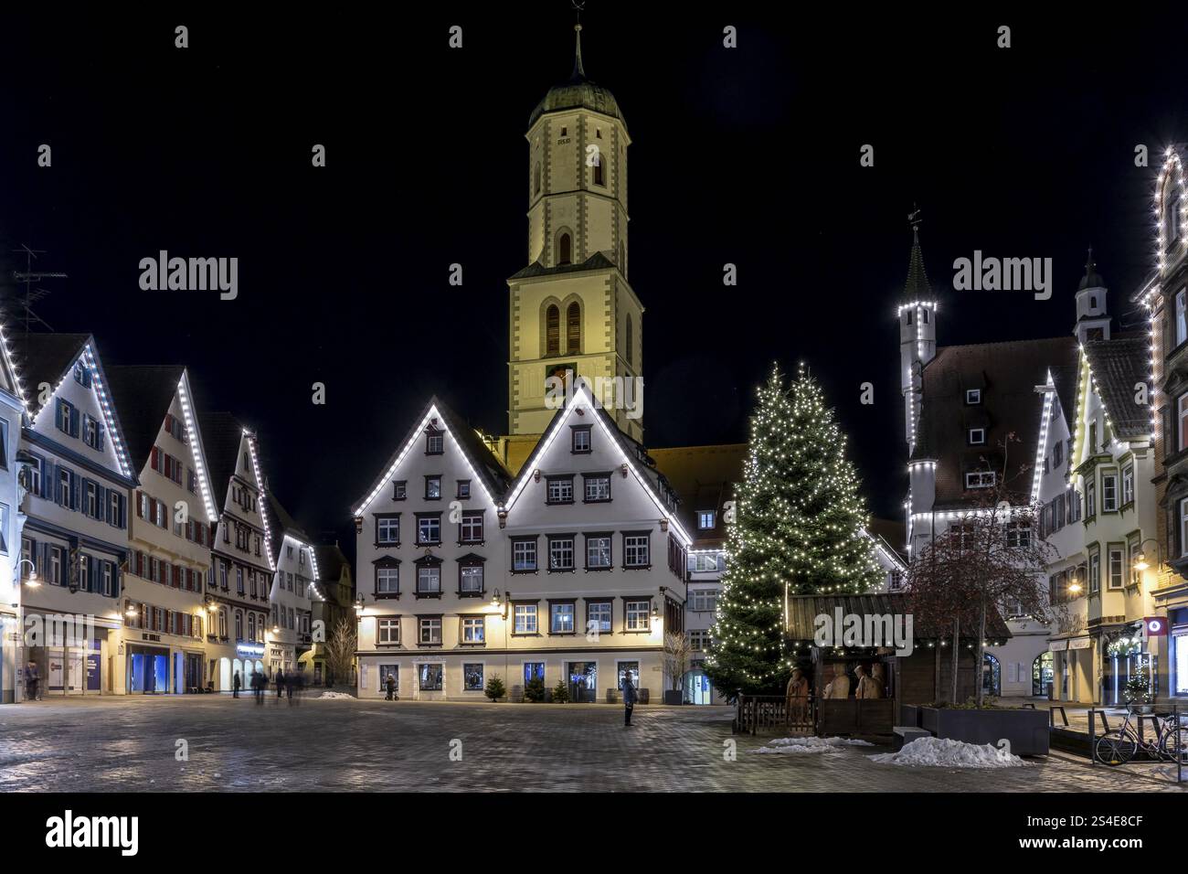 Night photo of historic buildings around the market square with ...