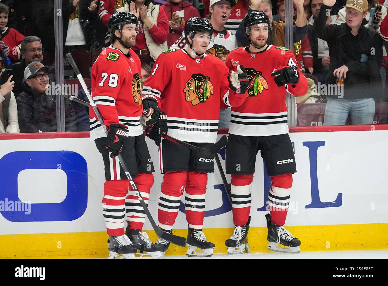 From left, Chicago Blackhawks defenseman TJ Brodie (78), center Ryan ...