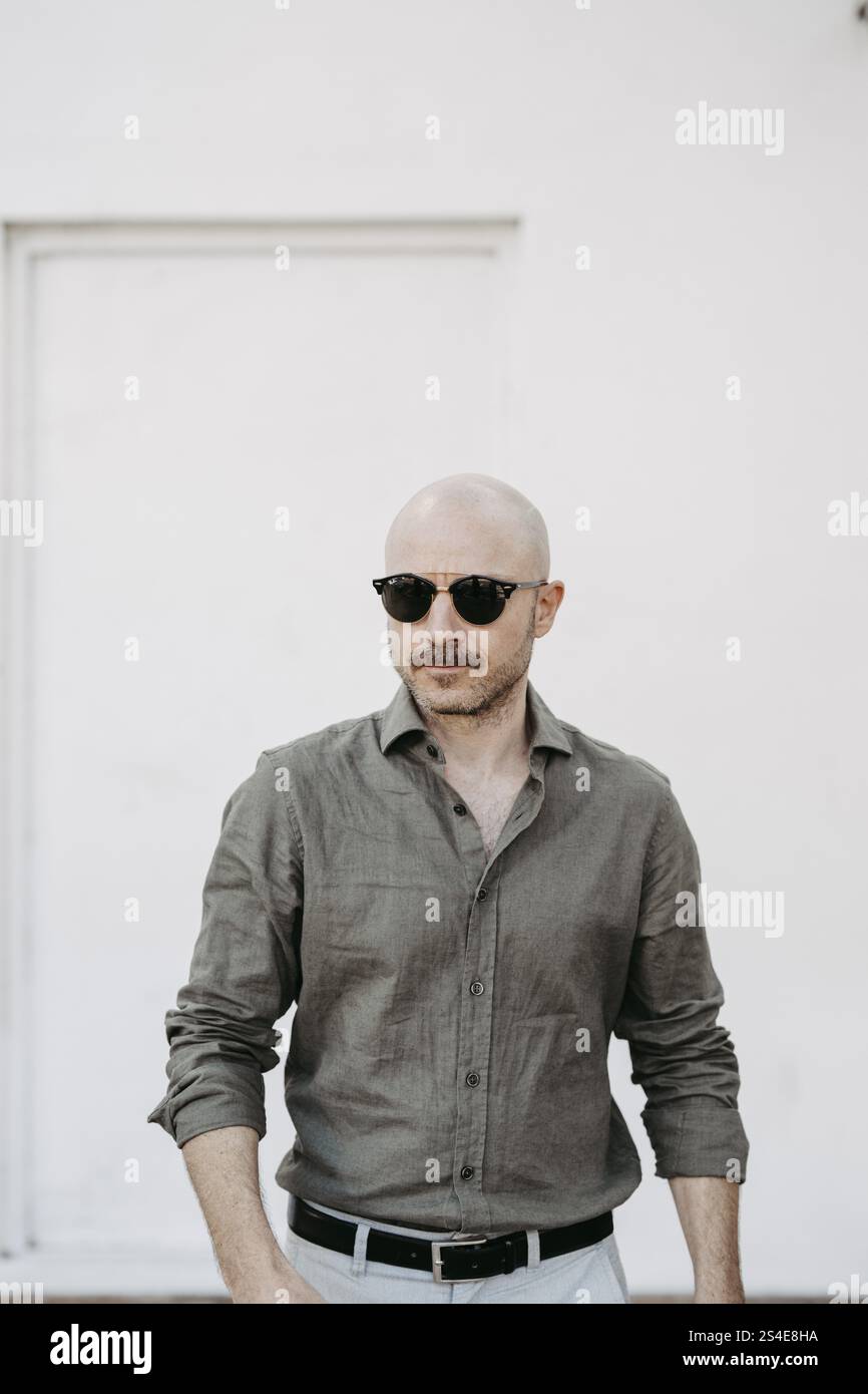 Man, 40, with bald head and sunglasses Stock Photo - Alamy