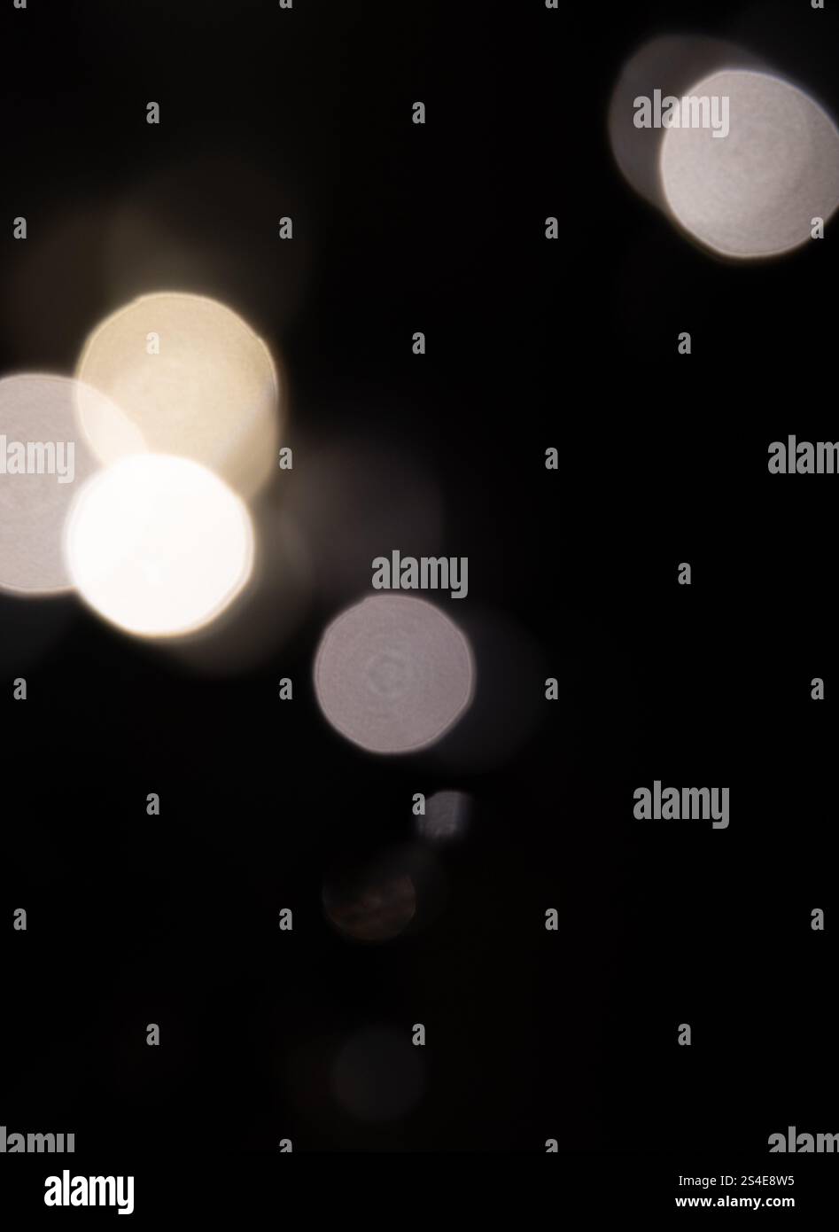 Abstract balls of light on black background Stock Photo - Alamy
