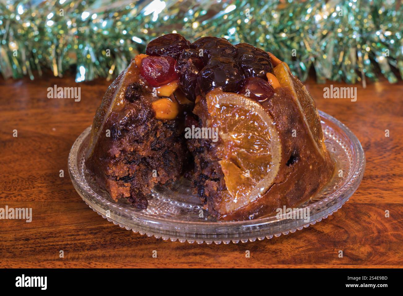 Traditional Festive Christmas Pudding, Fruit Cake on plate, look inside ...