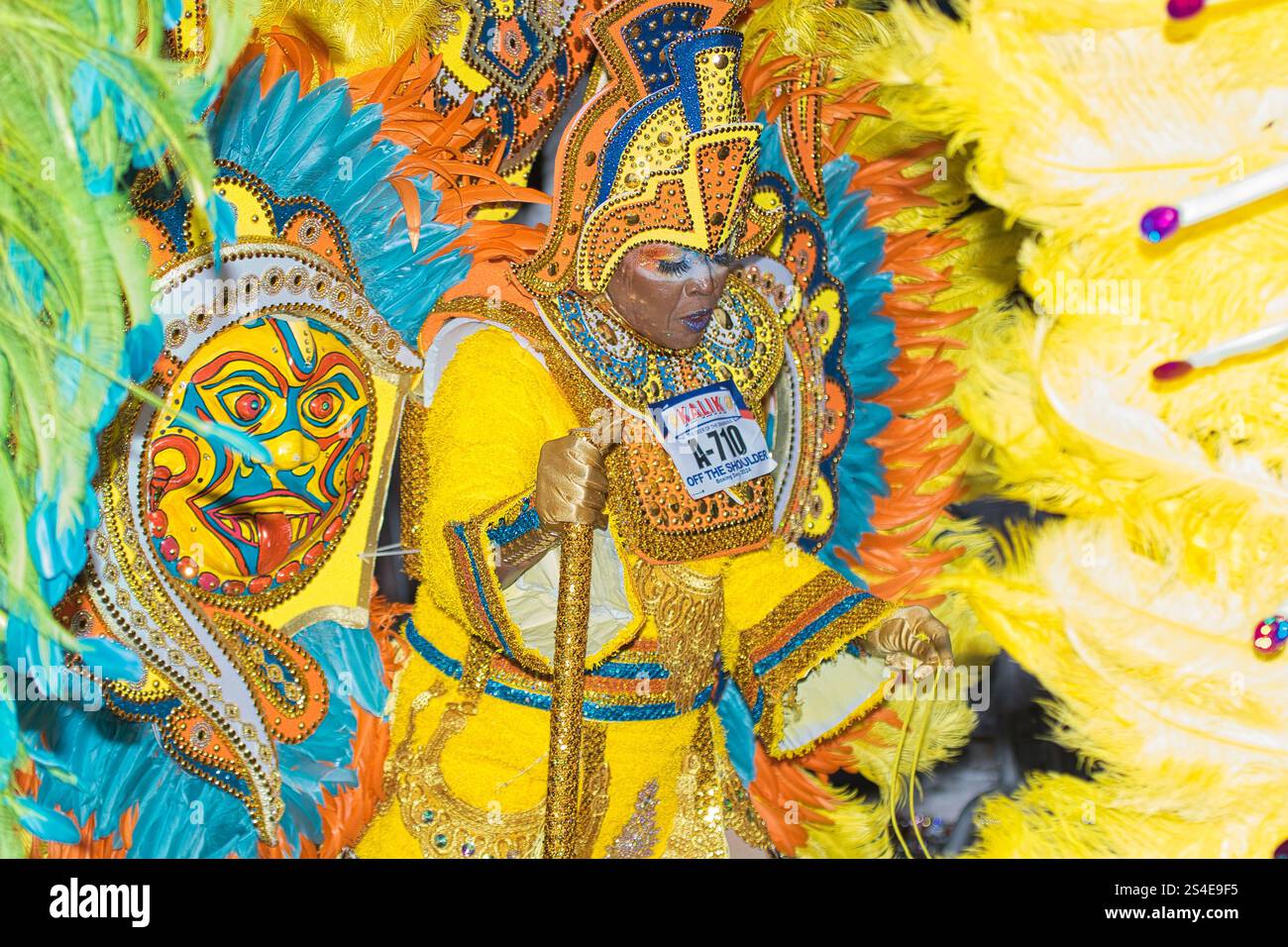 A lady dressed in bright yellow costumes was dancing at the Boxing Day ...