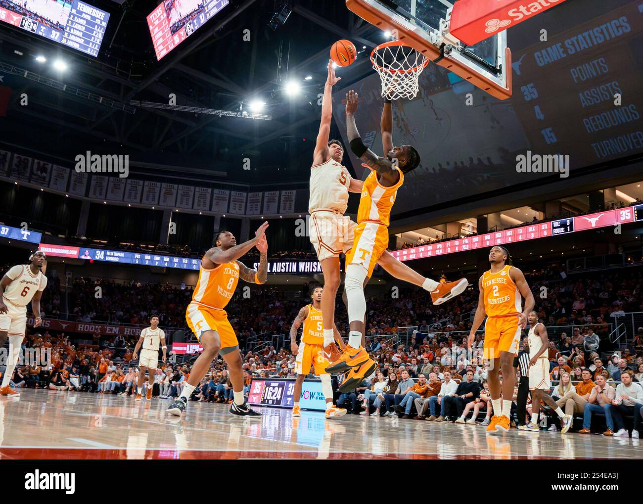 Texas forward Kadin Shedrick, left, puts up a shot against Tennessee ...