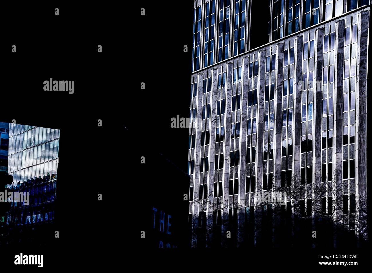 Dramatic light on a downtown office building Stock Photo - Alamy