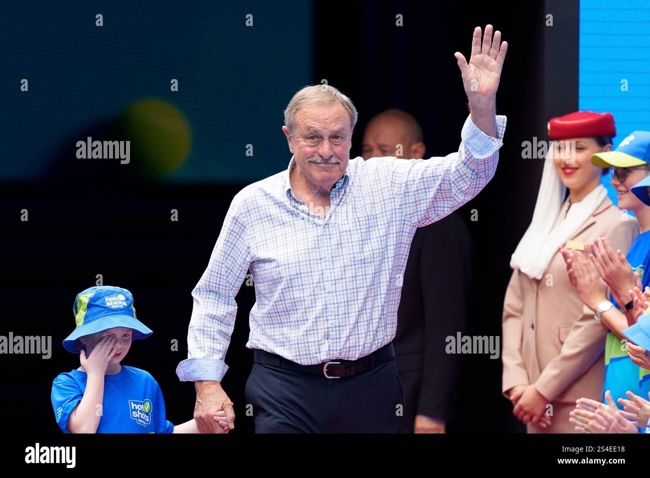 Melbourne, Australia. 12th Jan, 2025. JOHN NEWCOMBE of Australia enters the stadium to toss the ...