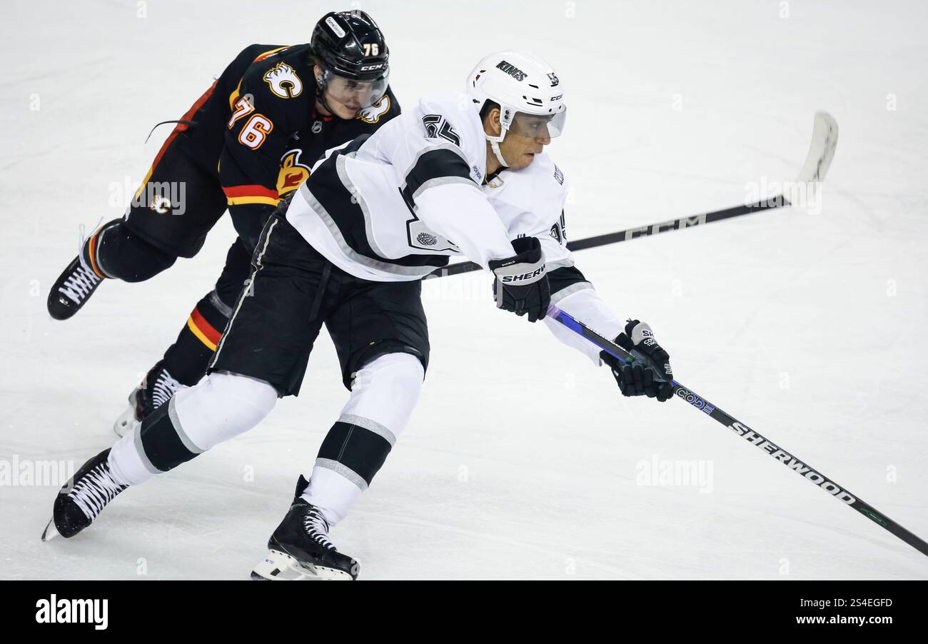 Los Angeles Kings' Quinton Byfield, right, gets away from Calgary ...