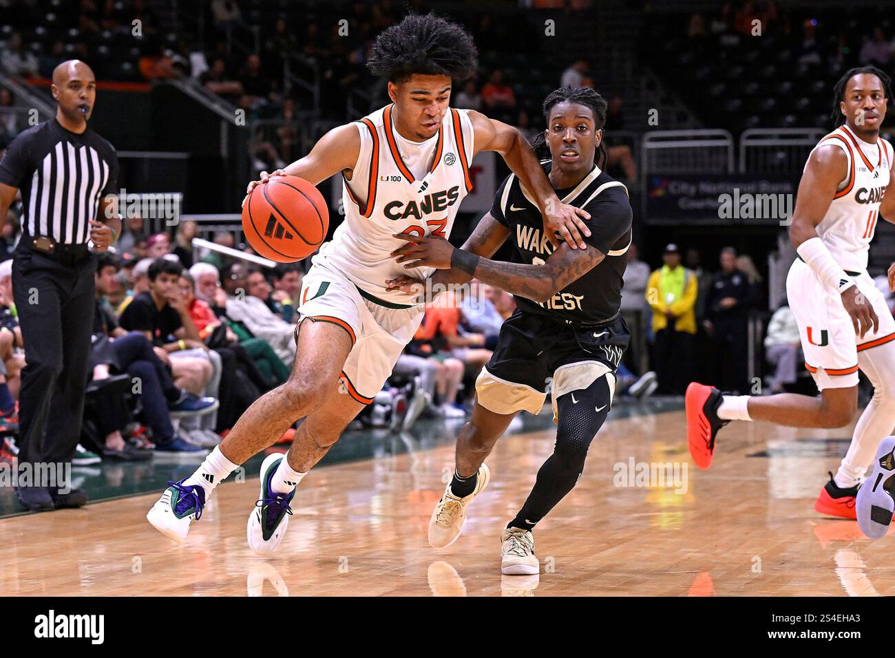 CORAL GABLES, FL - JANUARY 11: Miami guard Austin Swartz (23) drives to ...