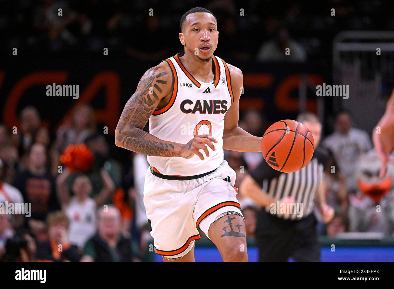 CORAL GABLES, FL - JANUARY 11: Miami guard Matthew Cleveland (0) brings ...