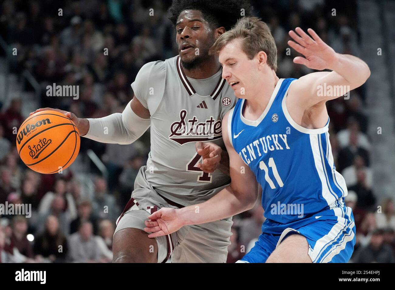 Mississippi State forward Cameron Matthews (4) is defended by Kentucky ...