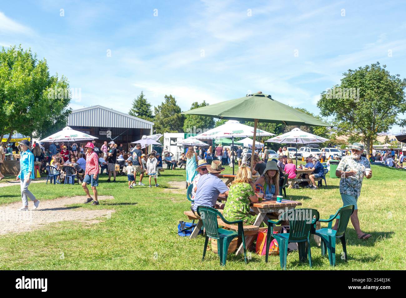 Tables and parasols busy stall stalls produce locally produced m hi-res ...