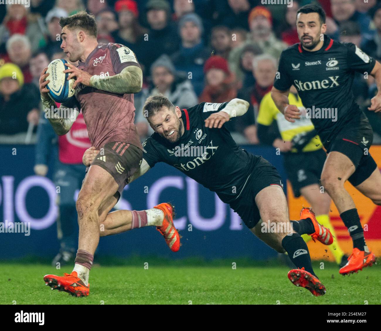 Limerick, Ireland. 12th Jan, 2025. Jack Crowley of Munster tackled by ...