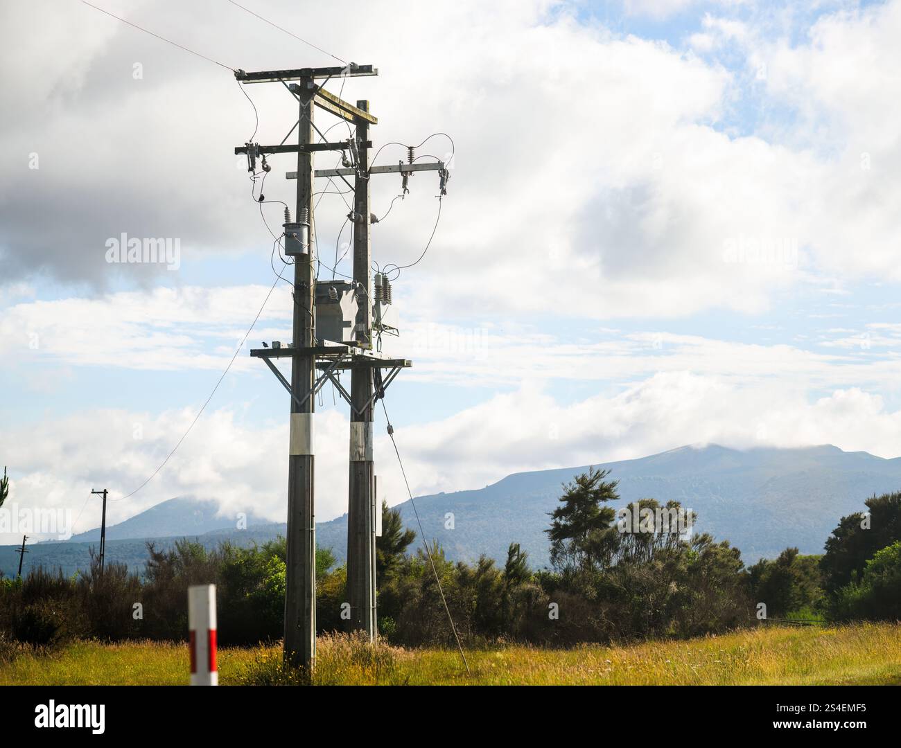 Transformer of an electrical post along the motorway. Mountains in the ...