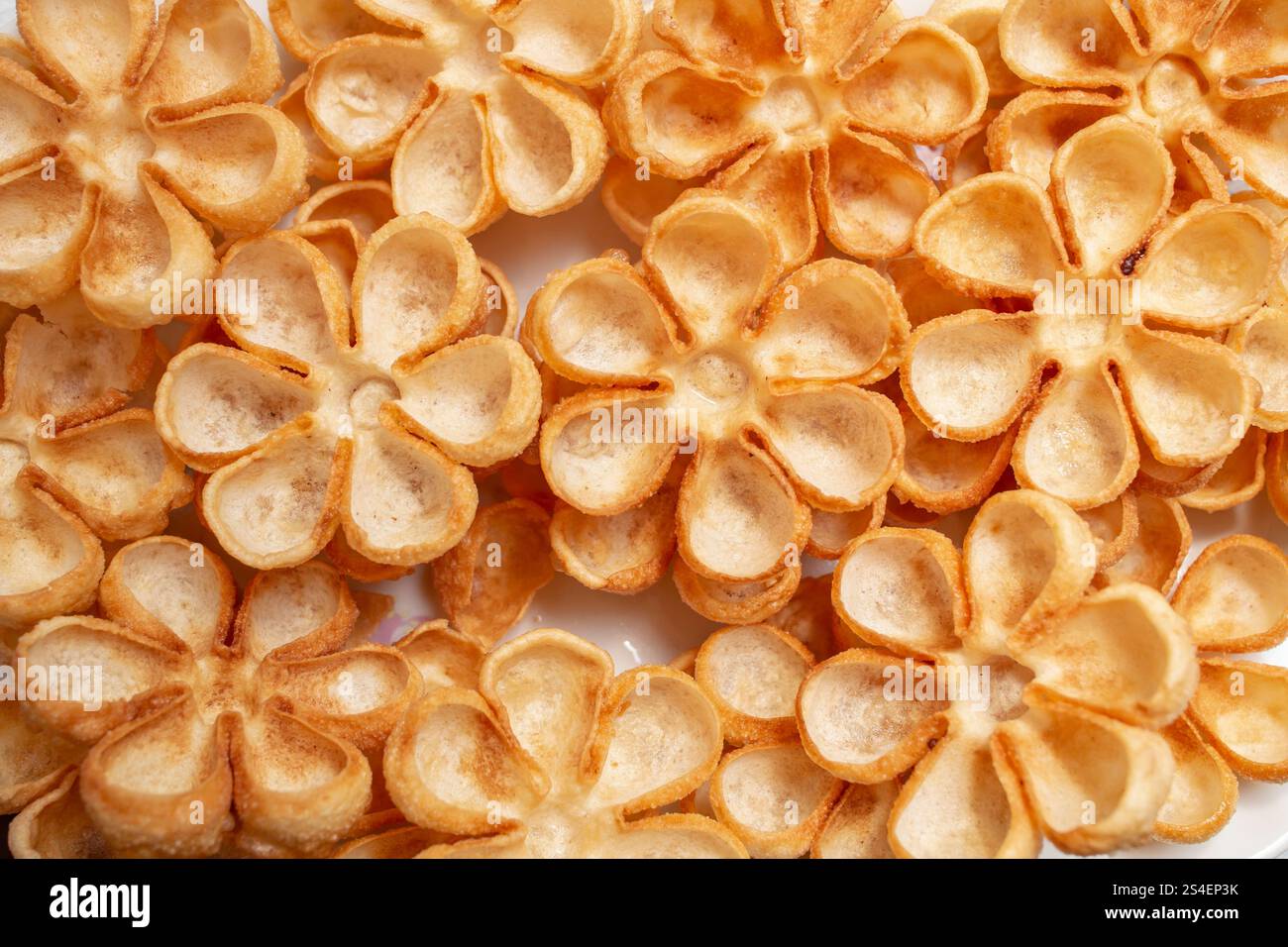 Deep fry flower shaped wafers rosettes stacked, full frame Stock Photo ...