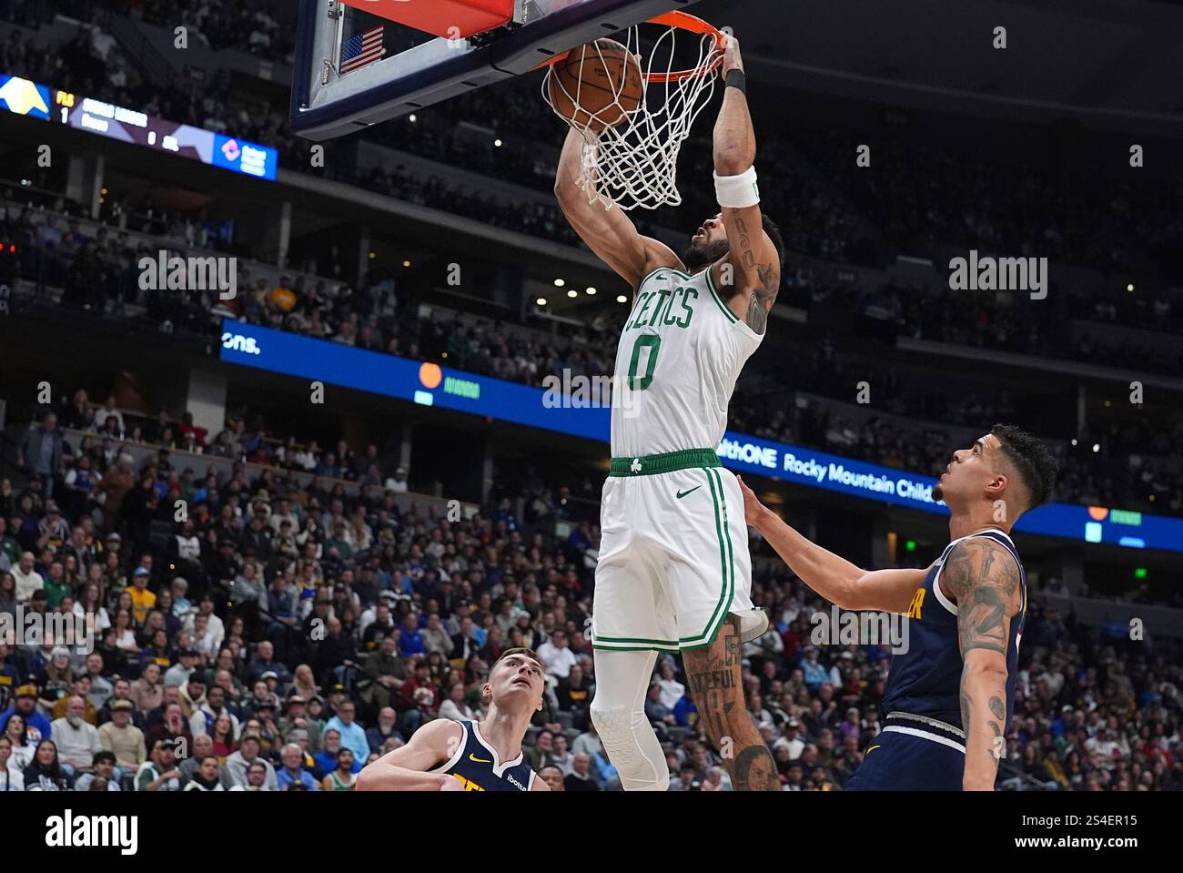 Boston Celtics forward Jayson Tatum (0) dunks the ball for a basket as ...