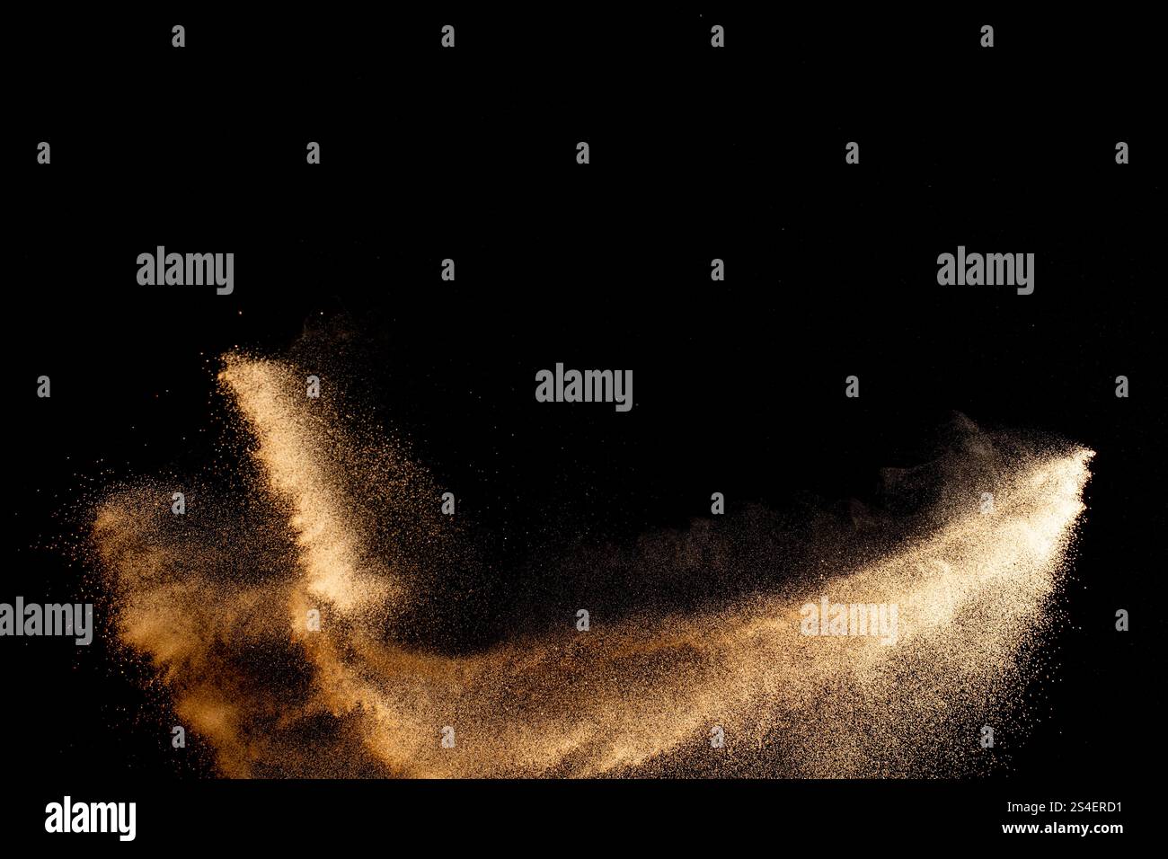 Sand flying explosion isolated on black background ,throwing freeze ...