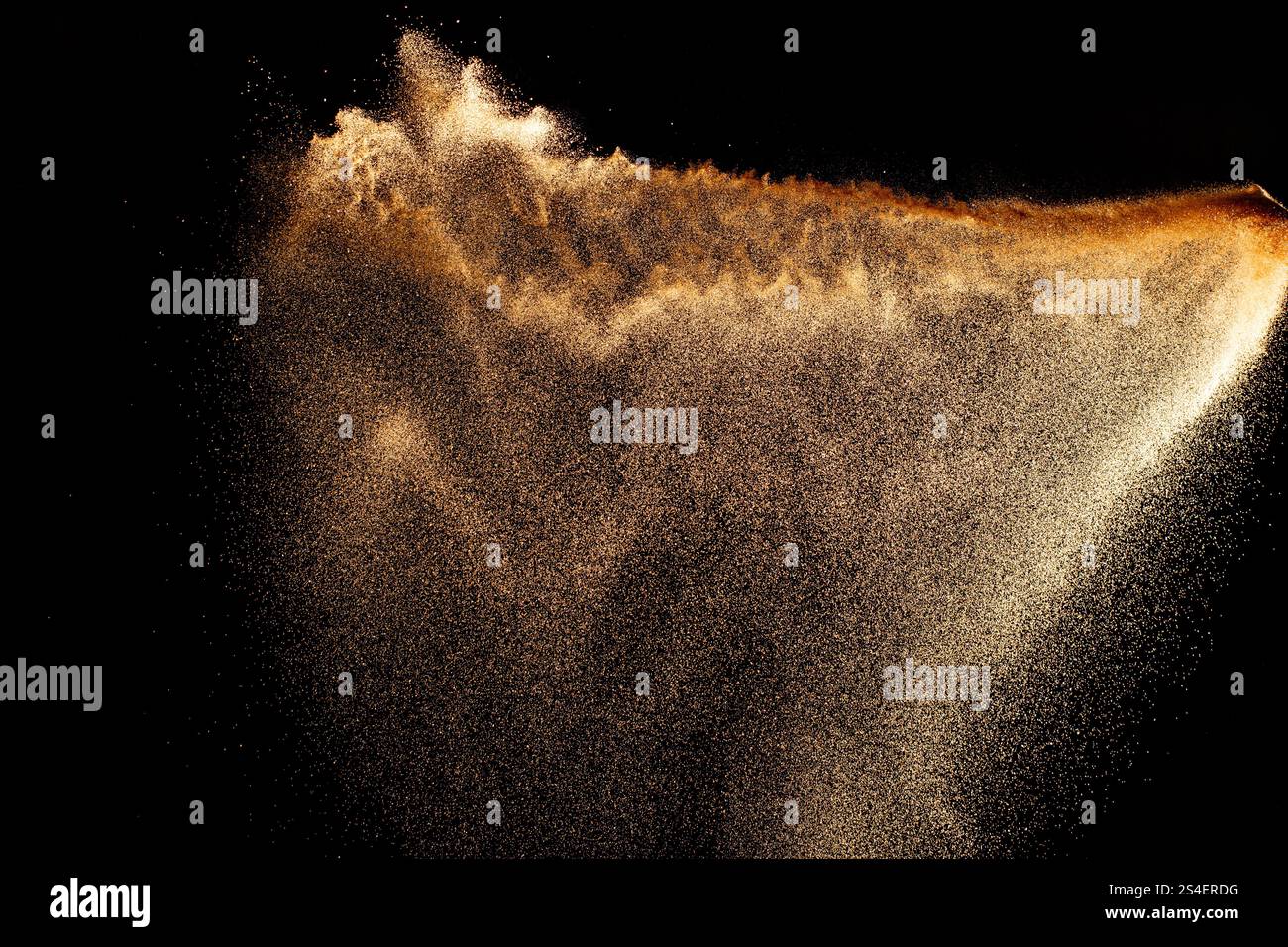 Sand flying explosion isolated on black background ,throwing freeze ...