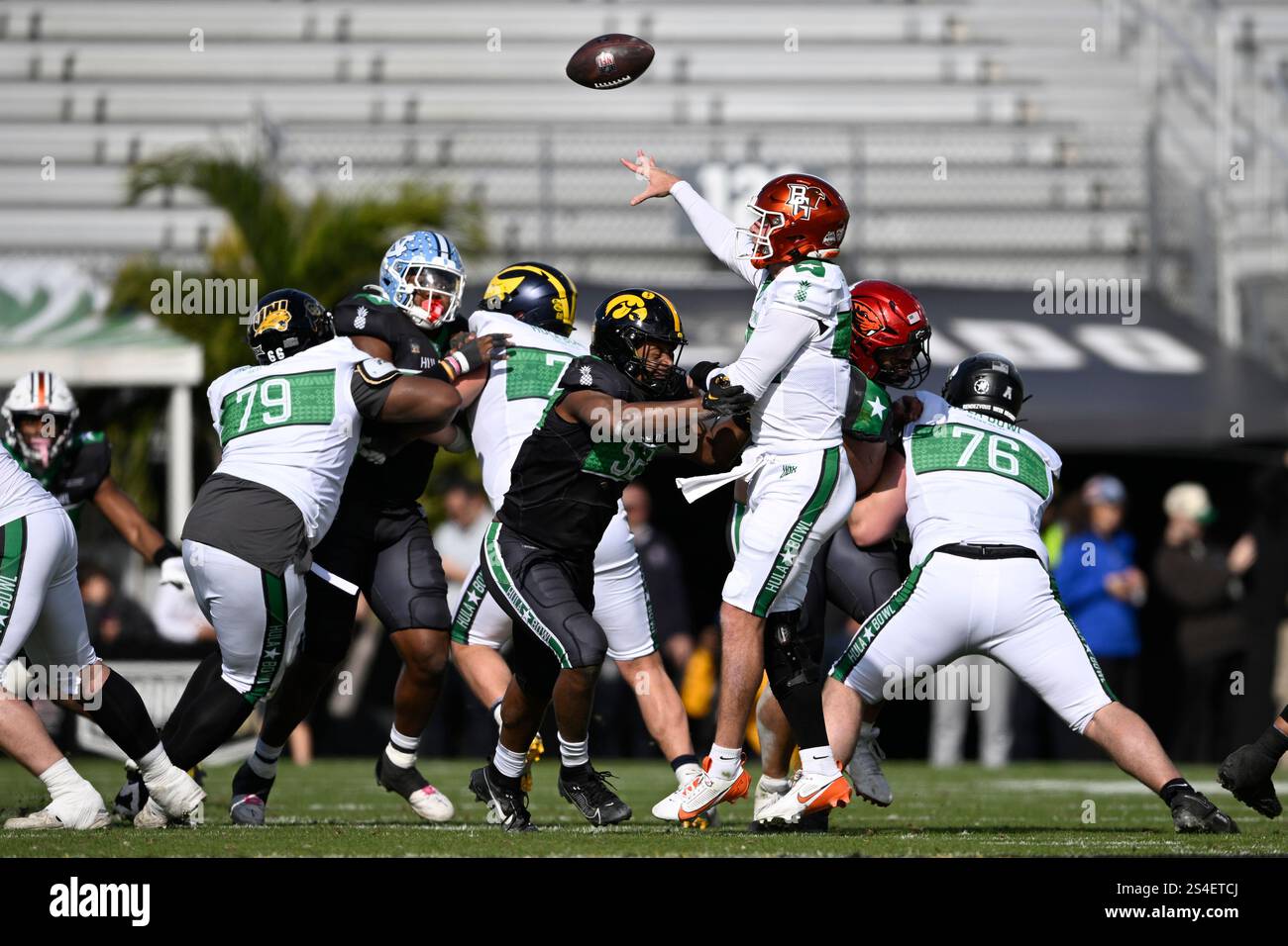 Team Kai quarterback Connor Bazelak throws a pass in front of Team Aina ...
