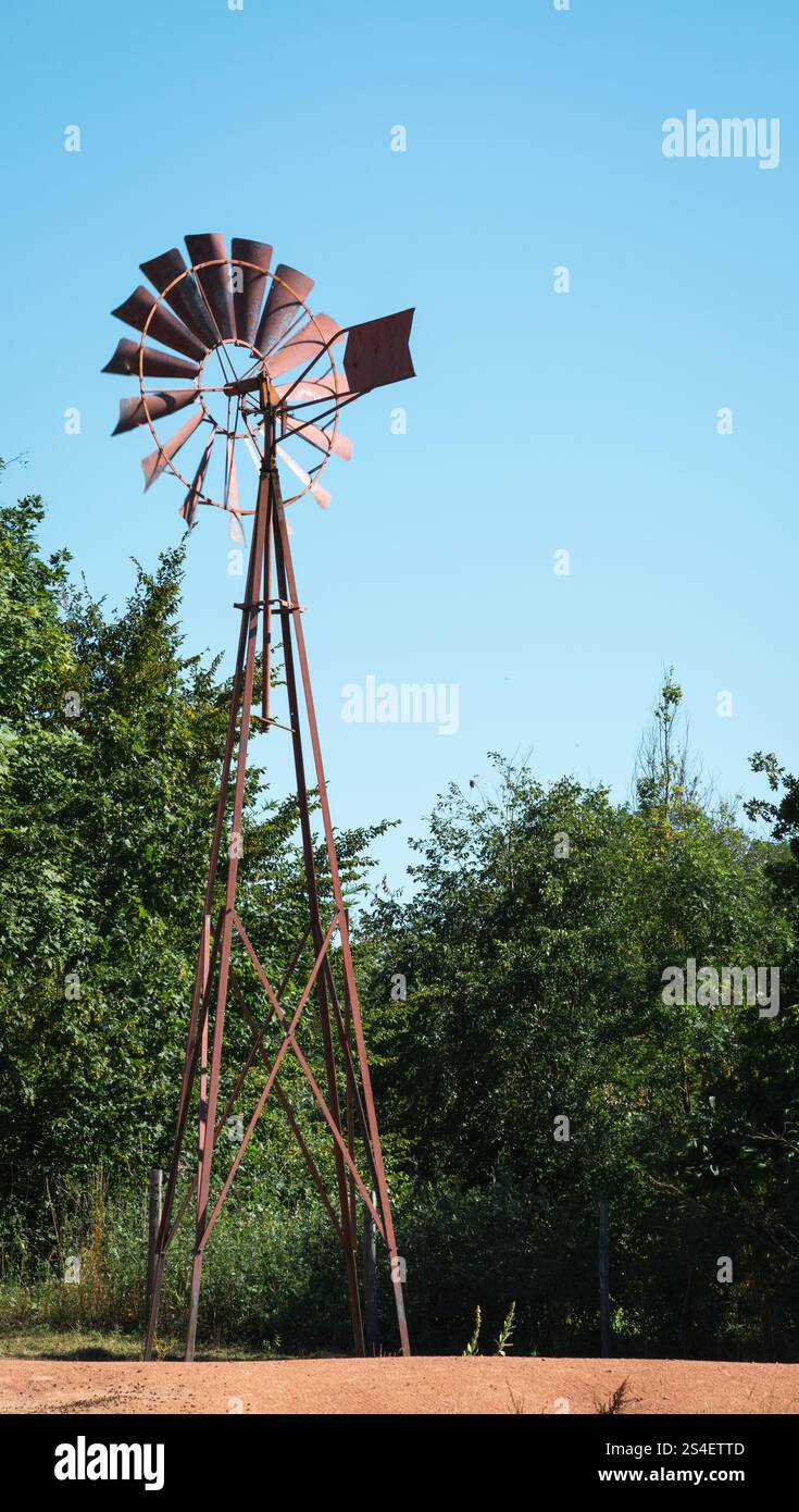 An old, rusty windmill beside the farm, still turning in the breeze ...