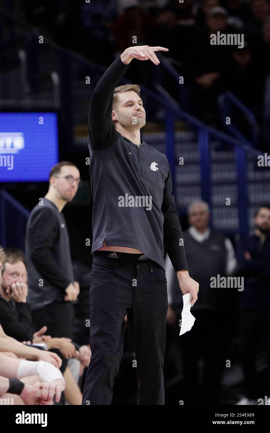 Washington State head coach David Riley directs his team during the ...