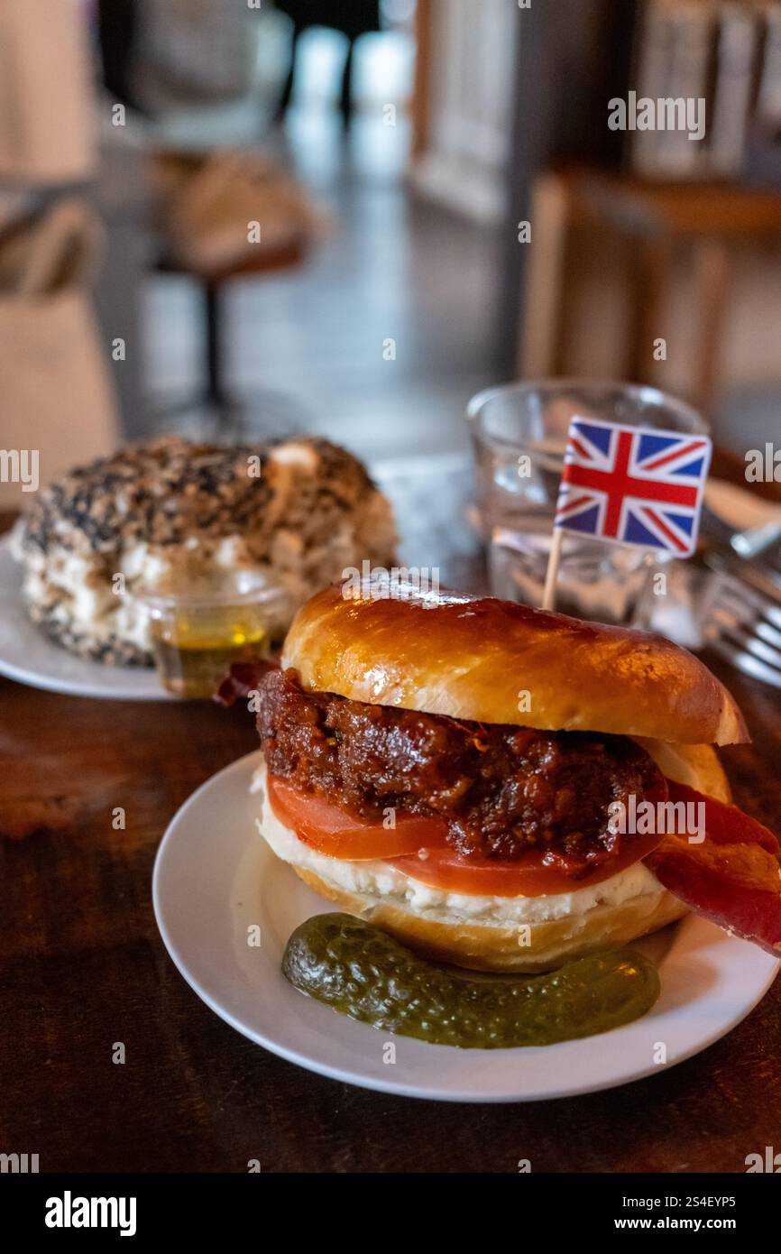 Various types of bagel served on plate in the restaurant Stock Photo ...