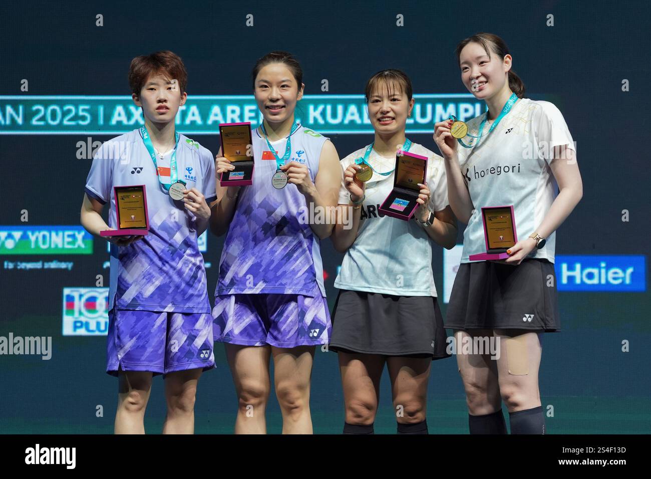 Japan's Yuki Fukushima and Mayu Matsumoto pose with second placed China ...
