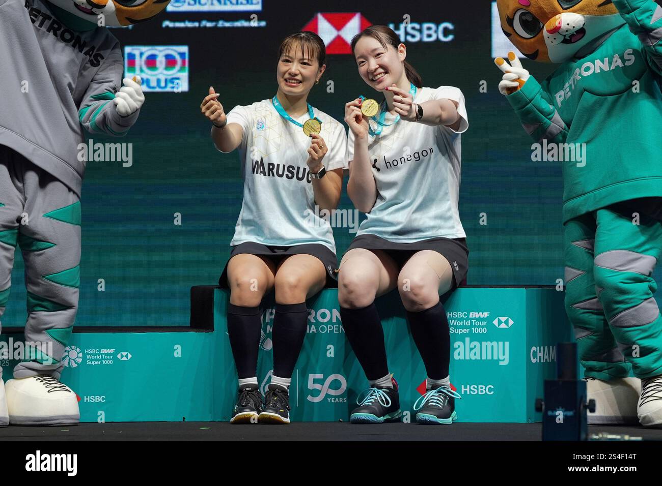 Second placed Japan's Yuki Fukushima, left, and Mayu Matsumoto pose ...