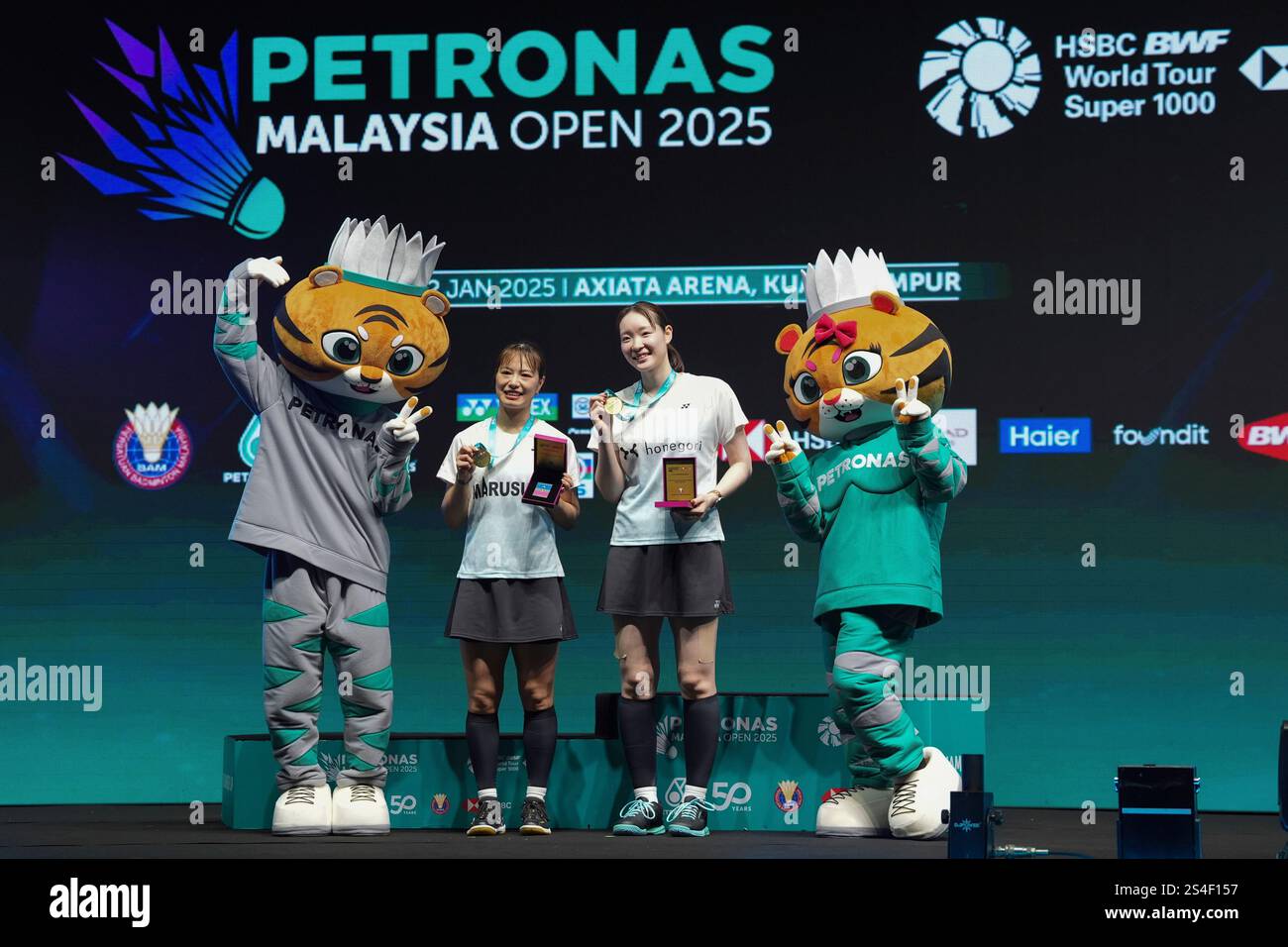 Second placed Japan's Yuki Fukushima, center left, and Mayu Matsumoto ...