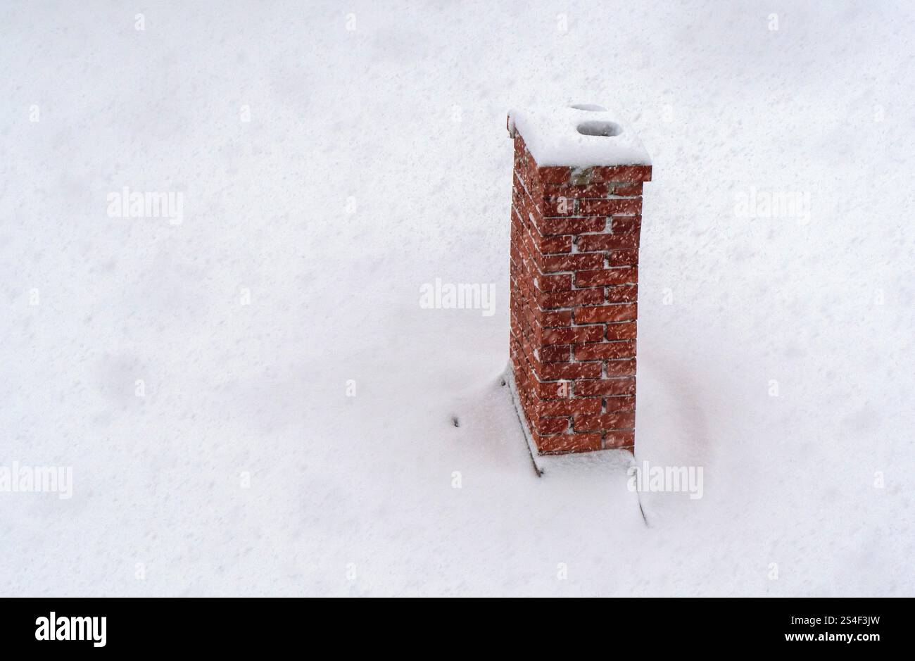 Winter Isolation: Brick Orange Chimney on a Snow-Covered Rooftop Stock ...
