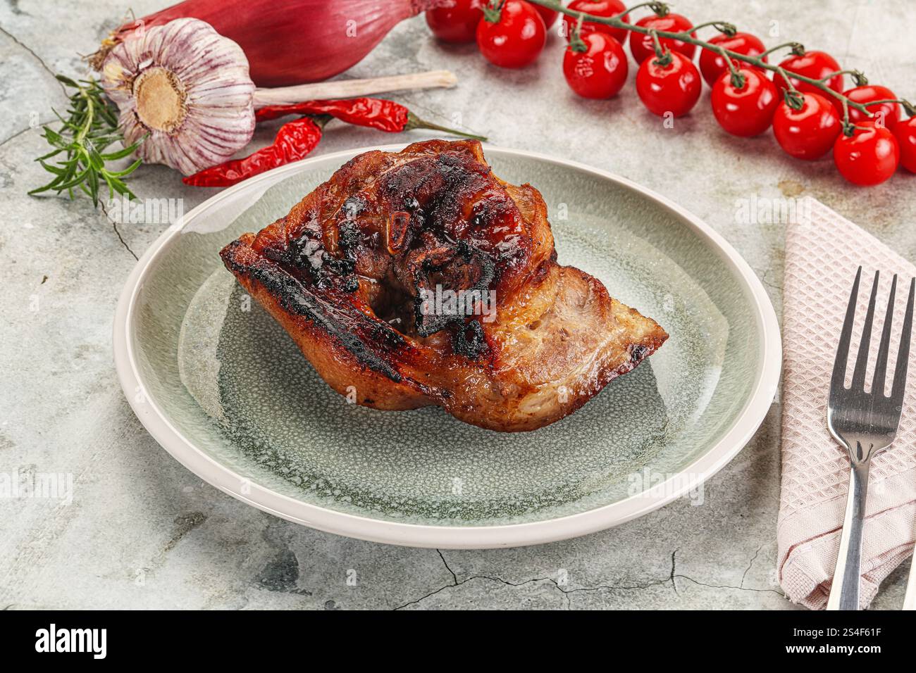 Roasted pork knuckle steak with bone Stock Photo - Alamy
