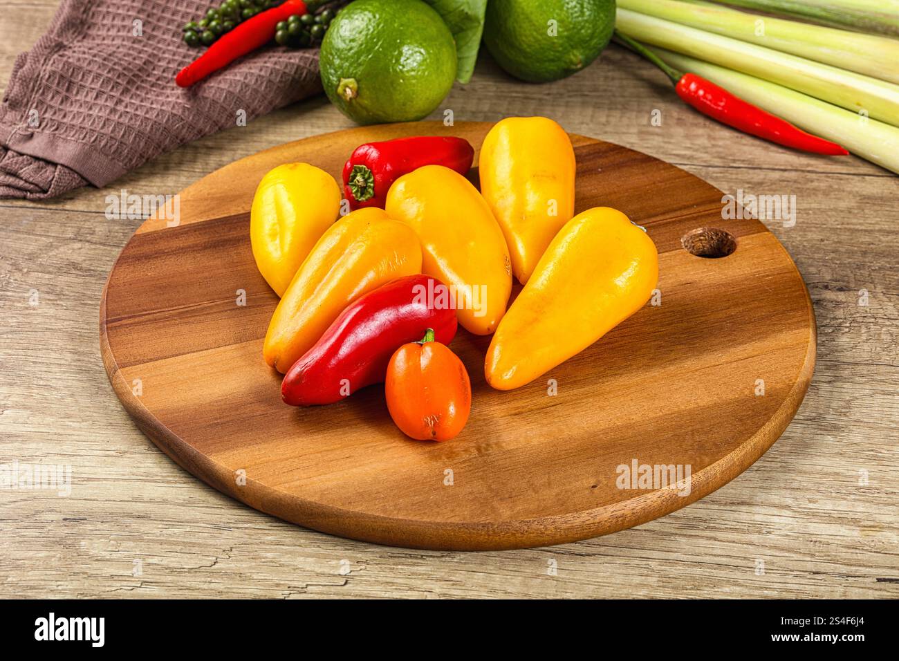 Small baby red and yellow bell pepper heap Stock Photo - Alamy