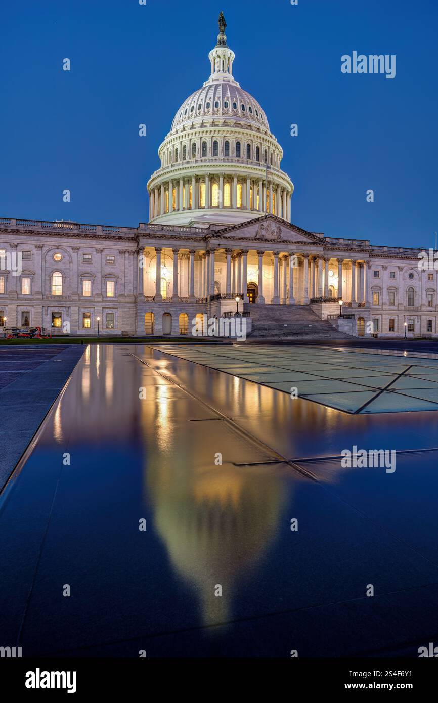 The illuminated U.S. Capitol Building in Washington D.C. at dawn with a ...