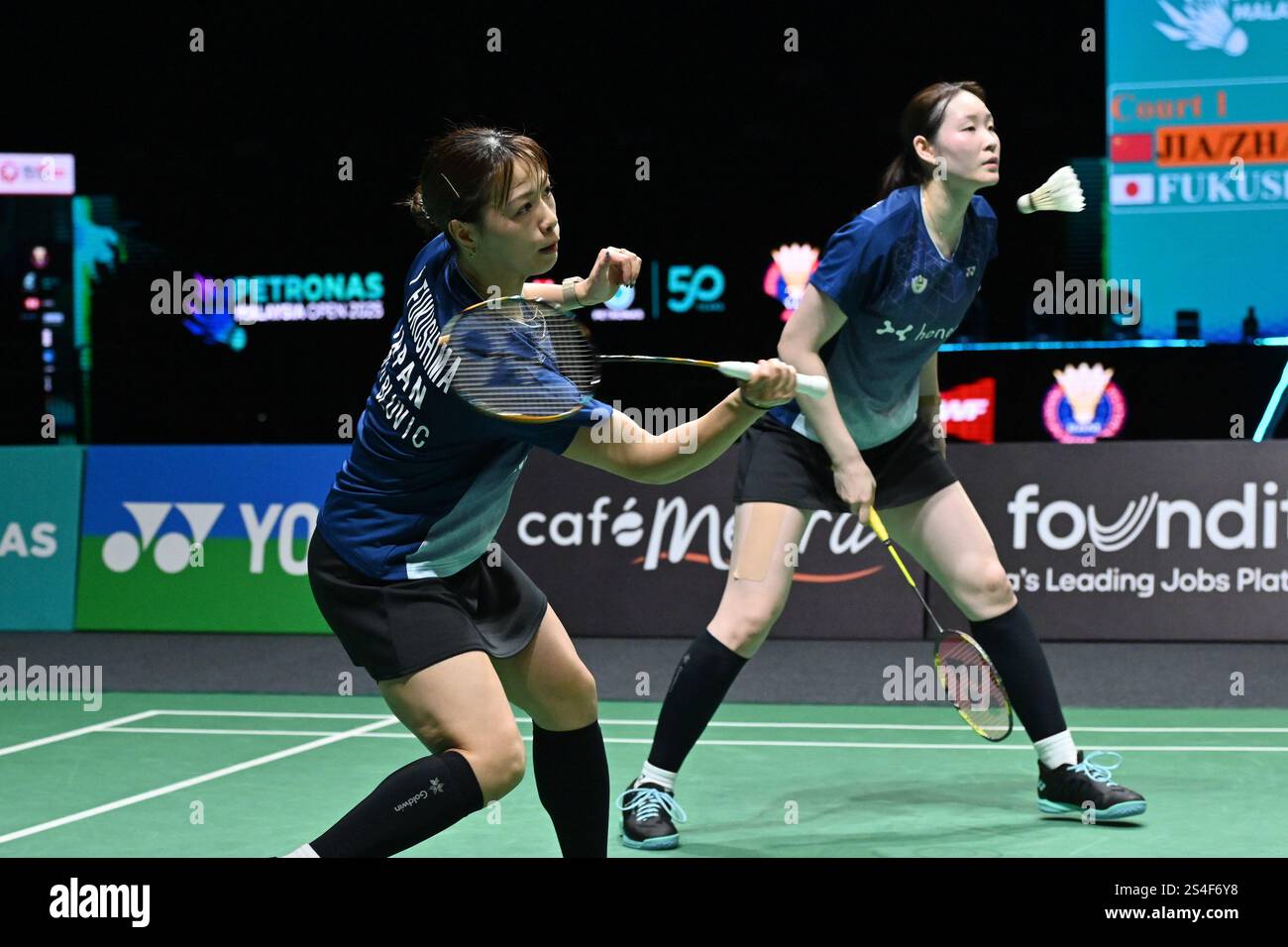 Kuala Lumpur, Malaysia. 12th Jan, 2025. Fukushima Yuki (L)/Matsumoto Mayu of Japan compete ...