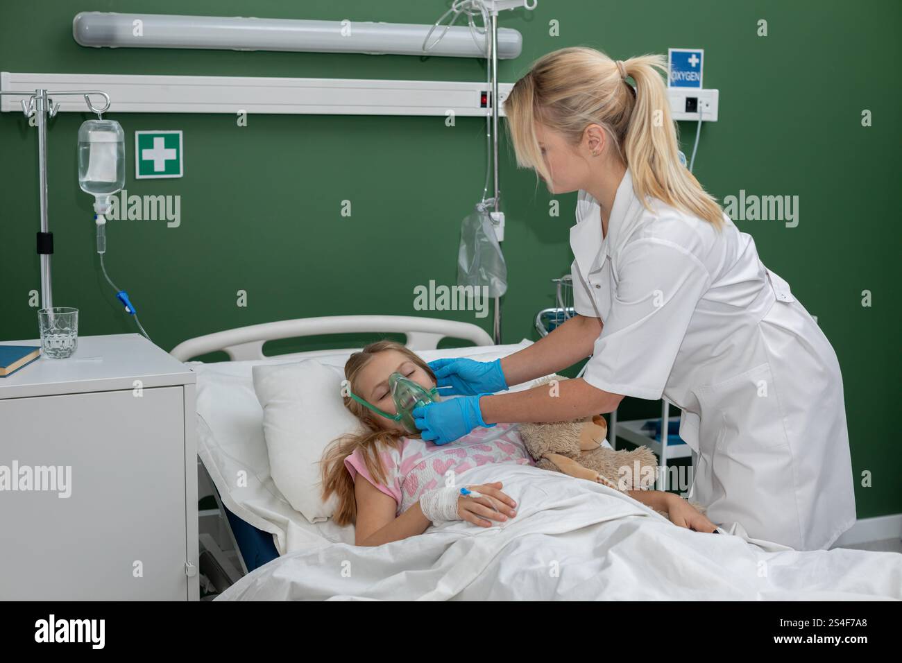 Child Receiving Medical Care in a Hospital Setting with Nurses and ...