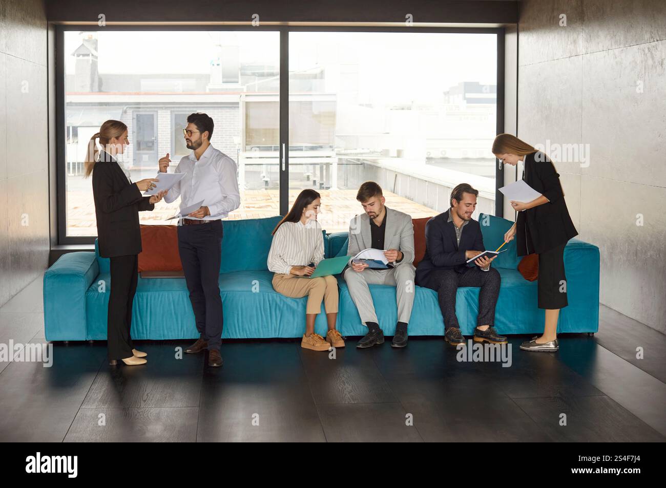 Business Team Divided Into Groups For Office Discussions Stock Photo ...