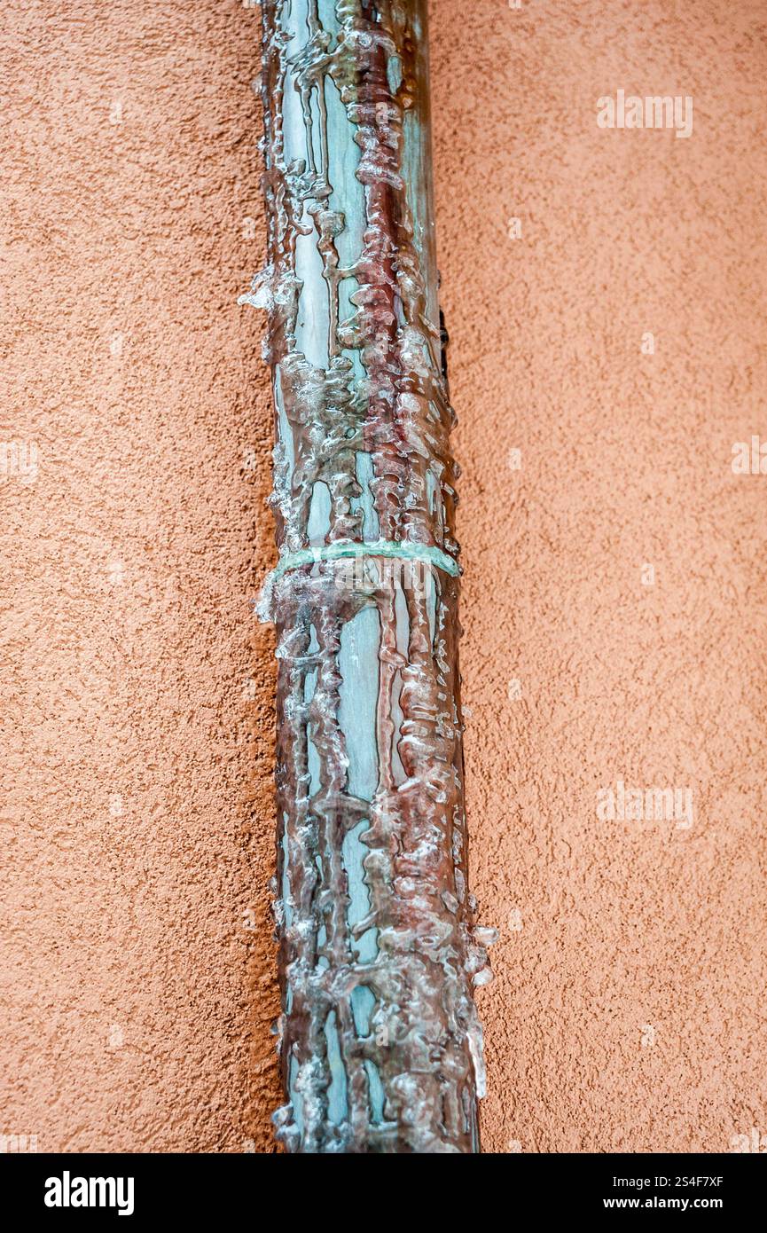 Frozen copper pipe. Water drain from house roof Stock Photo - Alamy