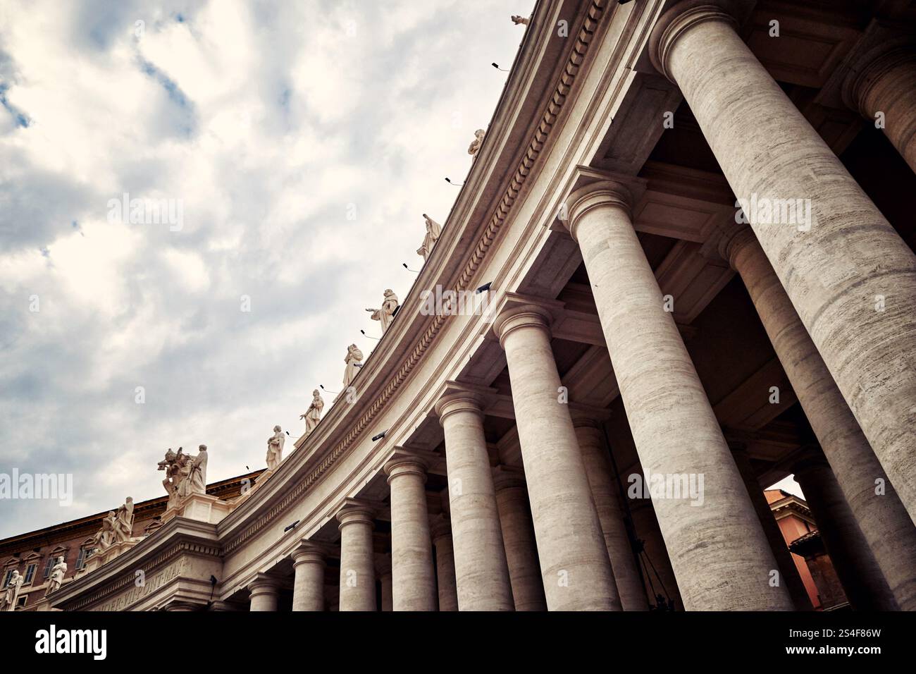 Colonnades that surround St. Peter's Square in Rome, Vatican City, with ...