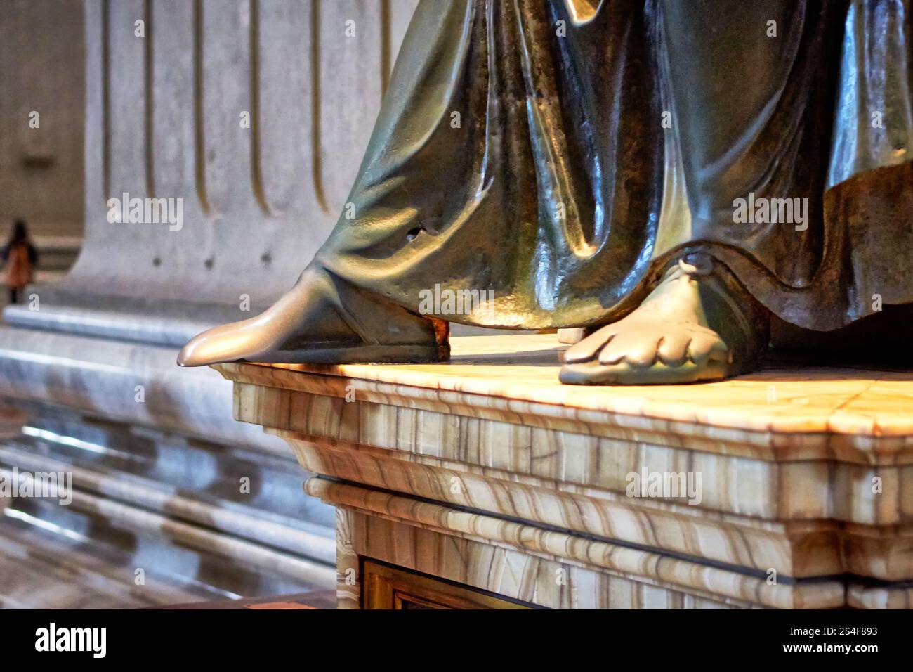 Worn out feet of the Statue of St. Peter in St. Peter's Basilica in the ...