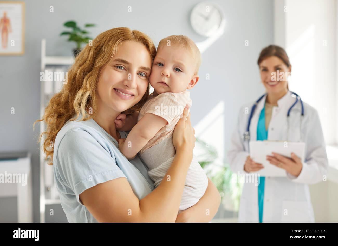 Portrait of a happy healthy young mother and her little baby at a ...