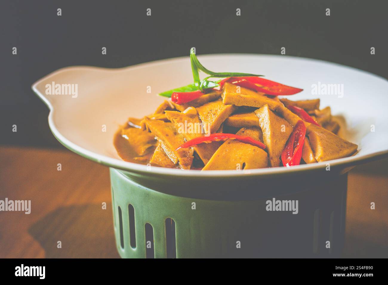 Dry Pot Beancurd made from Chiba tofu, pork, celtuce, leek served in a ...