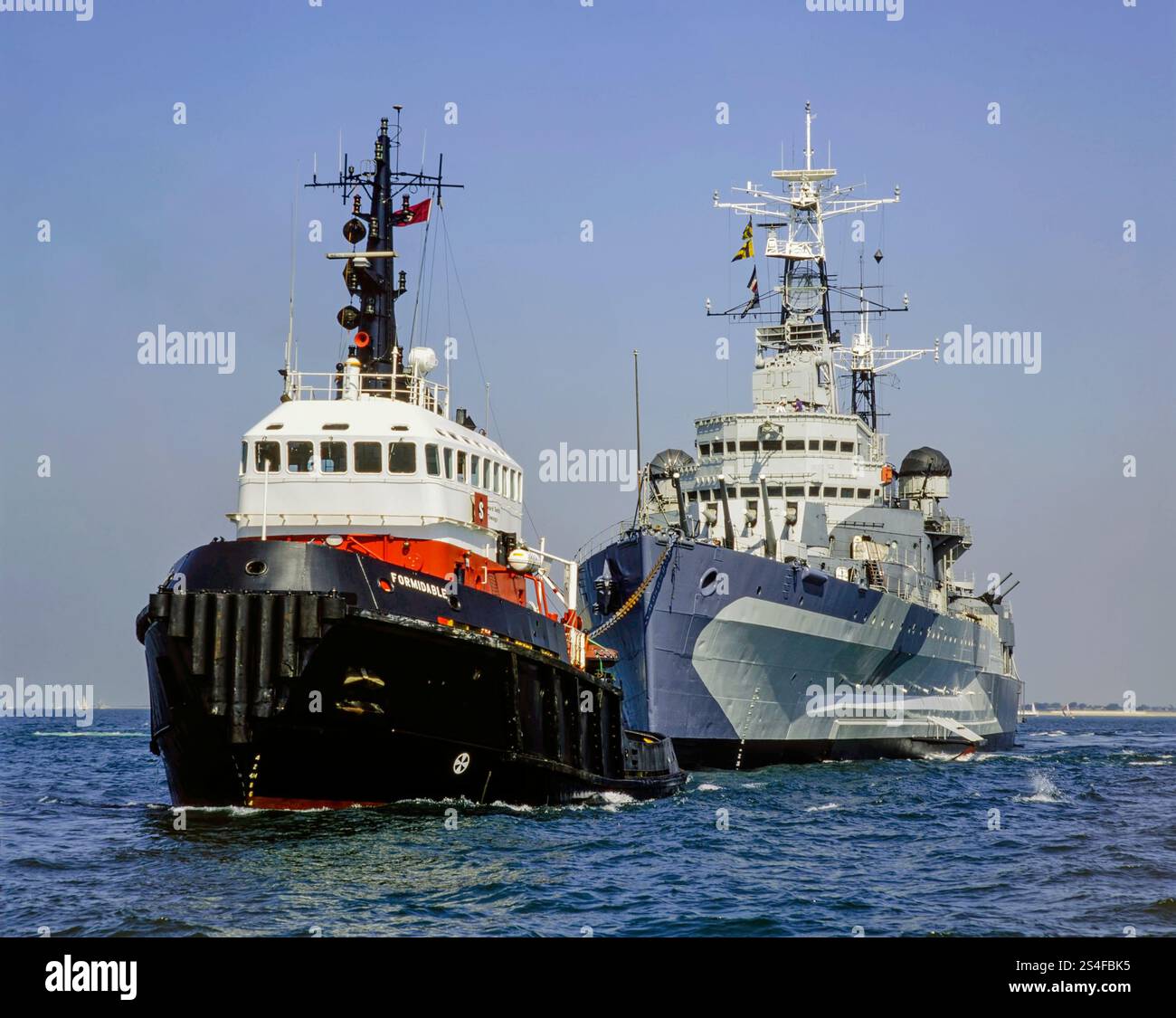 The Howard Smith tug Formidable towing the former WW2 cruiser HMS ...