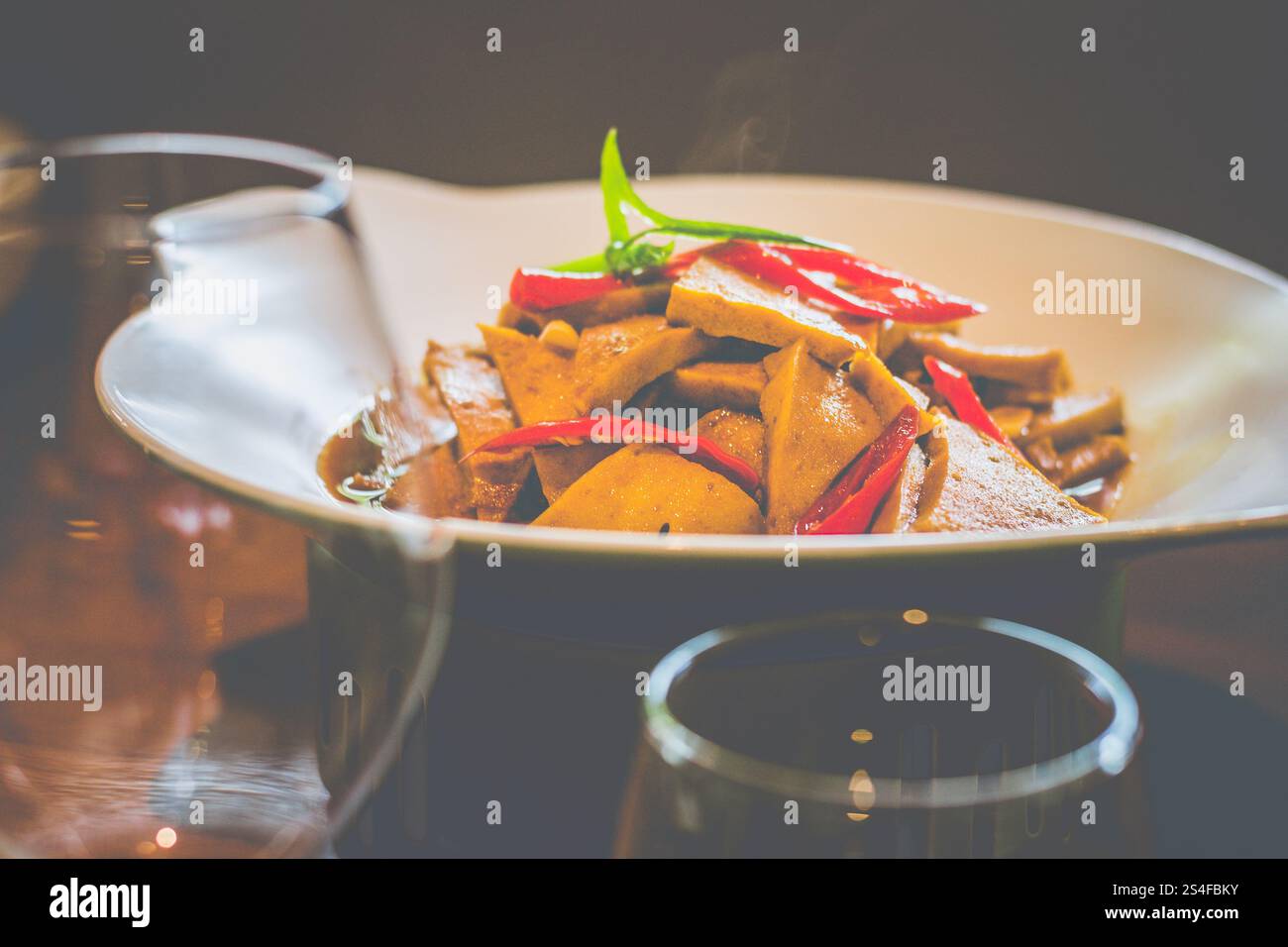 Dry Pot Beancurd made from Chiba tofu, pork, celtuce, leek served in a ...