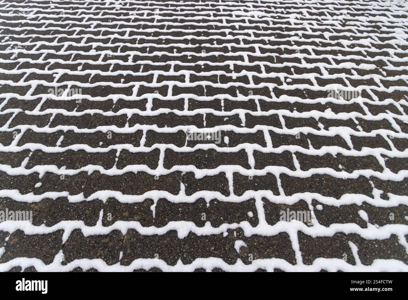 Snow traces left on a surface with bone stones form an interesting ...