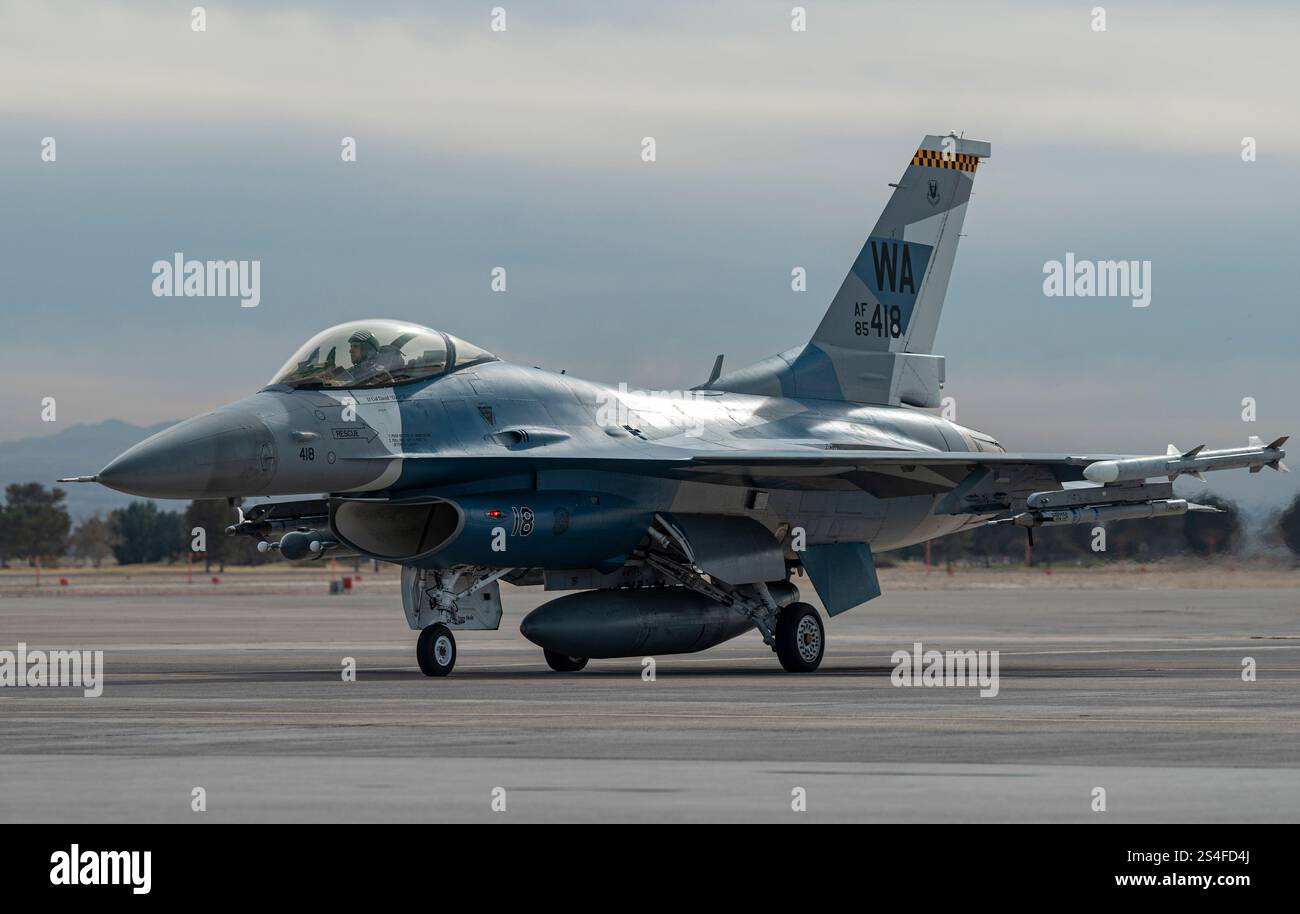 An F-16 Aggressor assigned to the 64th Aggressor Squadron, Nellis Air ...