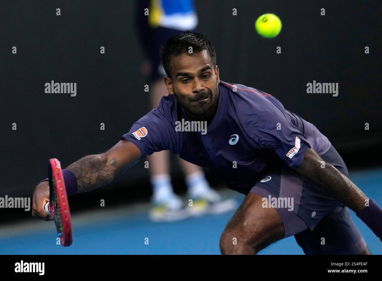 Sumit Nagal of India plays a forehand return to Tomas Machac of the ...