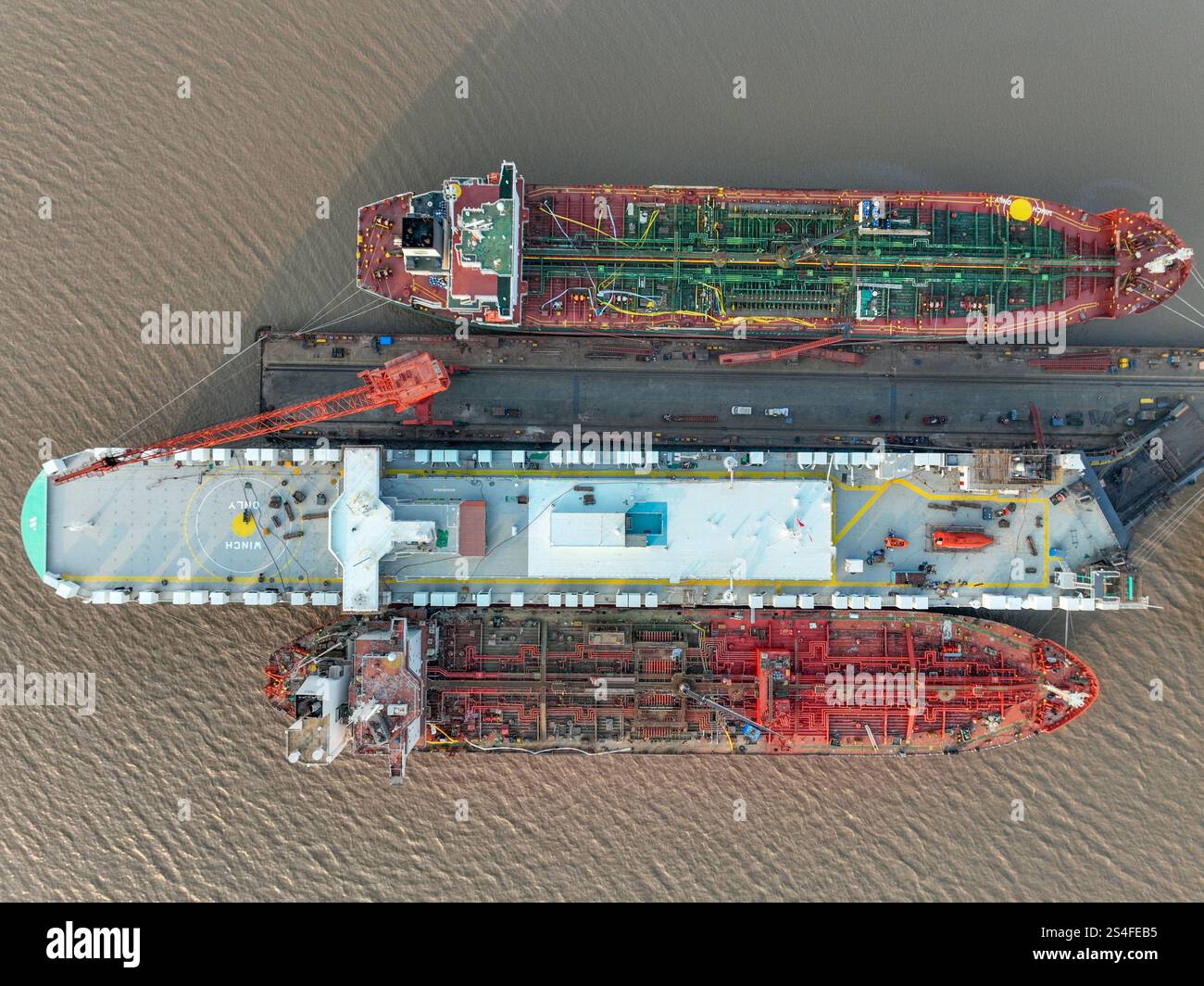 Zhoushan, China. 12th Jan, 2025. Workers repair a ship at a ship repair ...