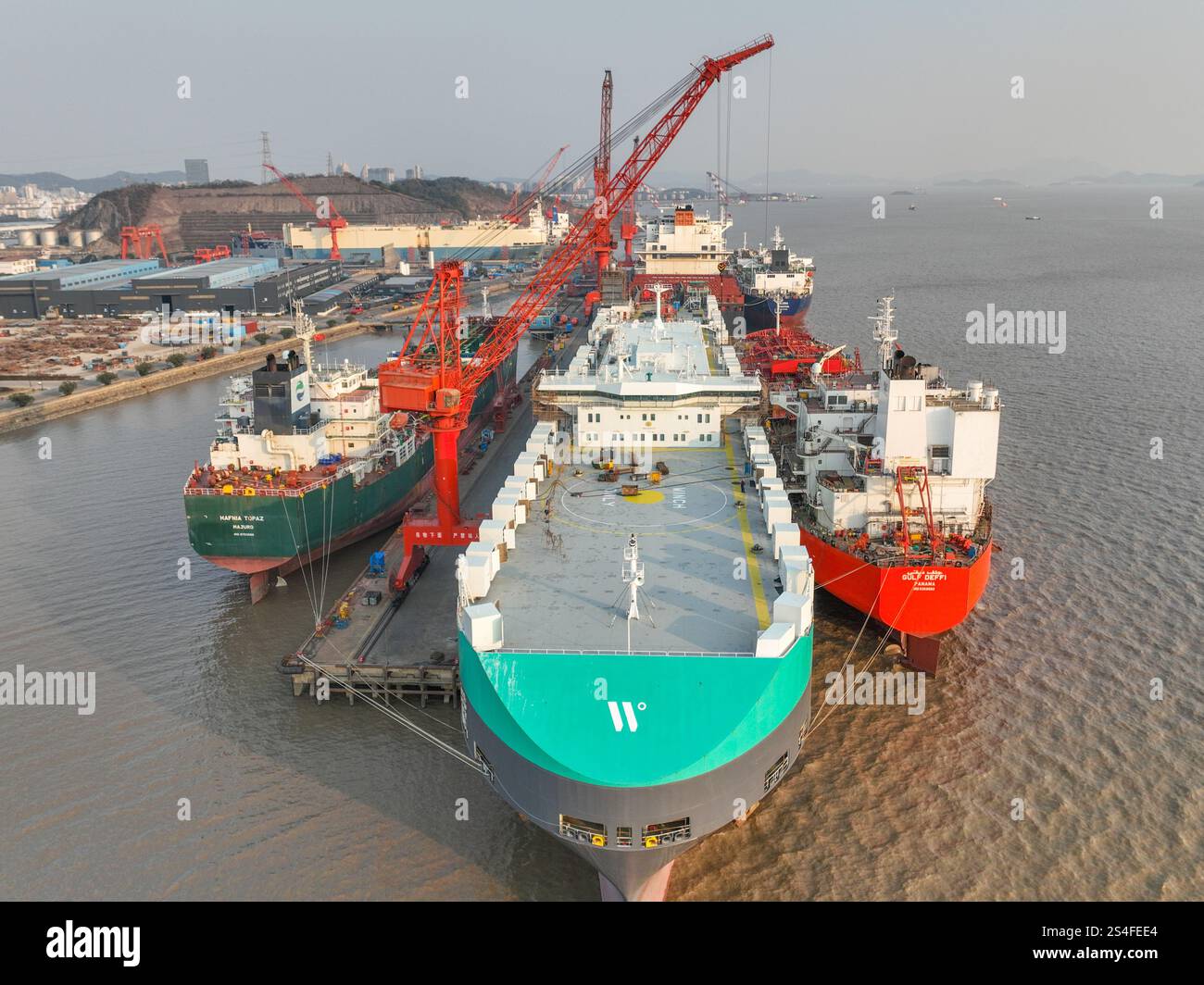 Zhoushan, China. 12th Jan, 2025. Workers repair a ship at a ship repair ...