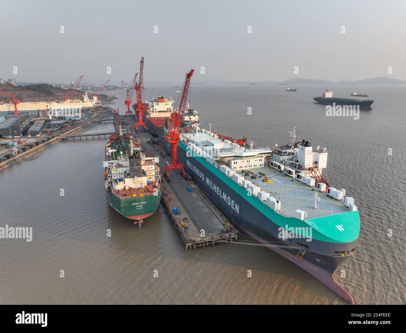 Zhoushan, China. 12th Jan, 2025. Workers repair a ship at a ship repair ...