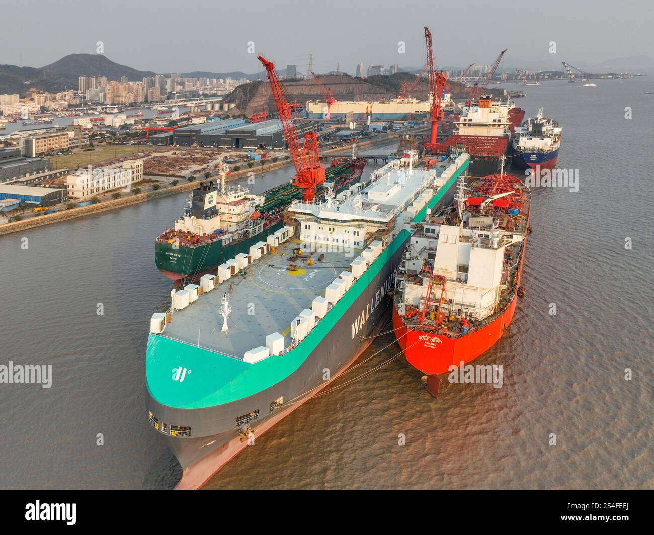Zhoushan, China. 12th Jan, 2025. Workers repair a ship at a ship repair ...